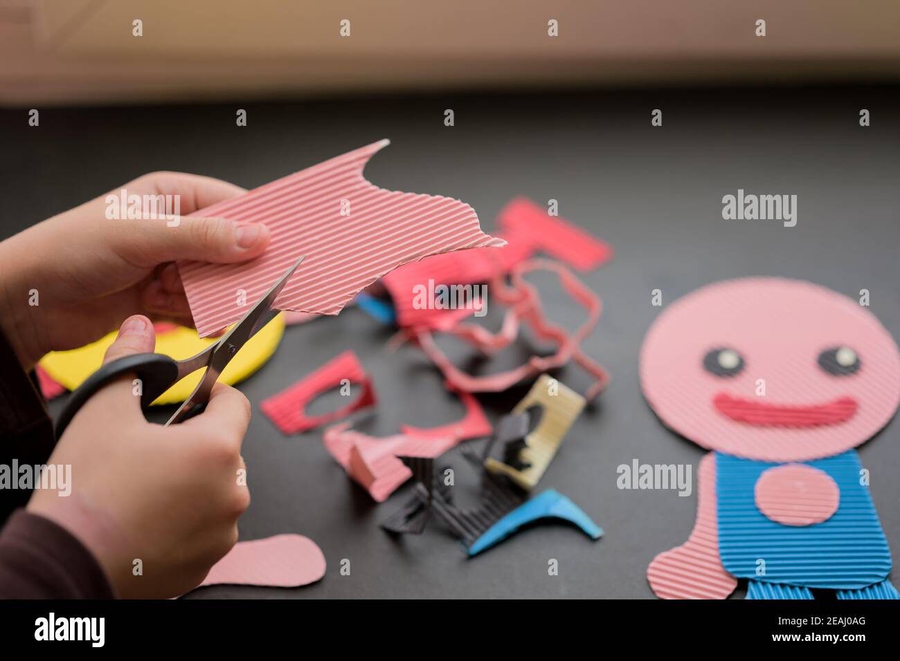 Little girl cutting paper scissors hi-res stock photography and images ...