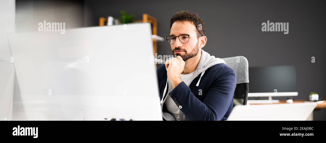 Employee Using Business Computer Stock Photo - Alamy