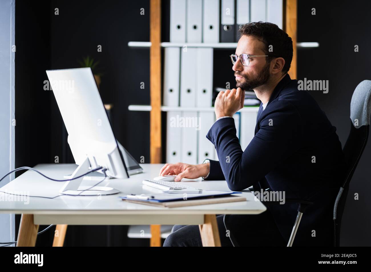 Employee Using Business Computer Stock Photo - Alamy