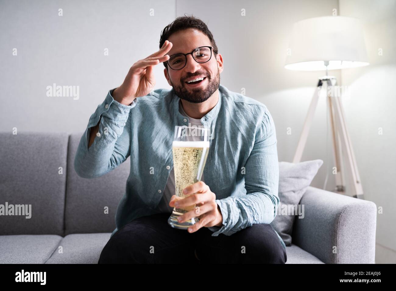 Man Drinking Beverage Beer In Video Conference Stock Photo - Alamy