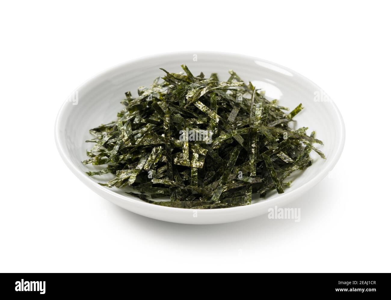 Chopped seaweed on a white background Stock Photo - Alamy