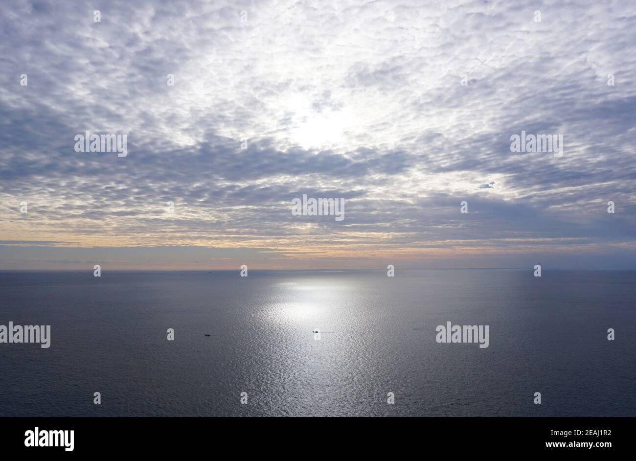 The vast ocean and small fishing boats Stock Photo - Alamy