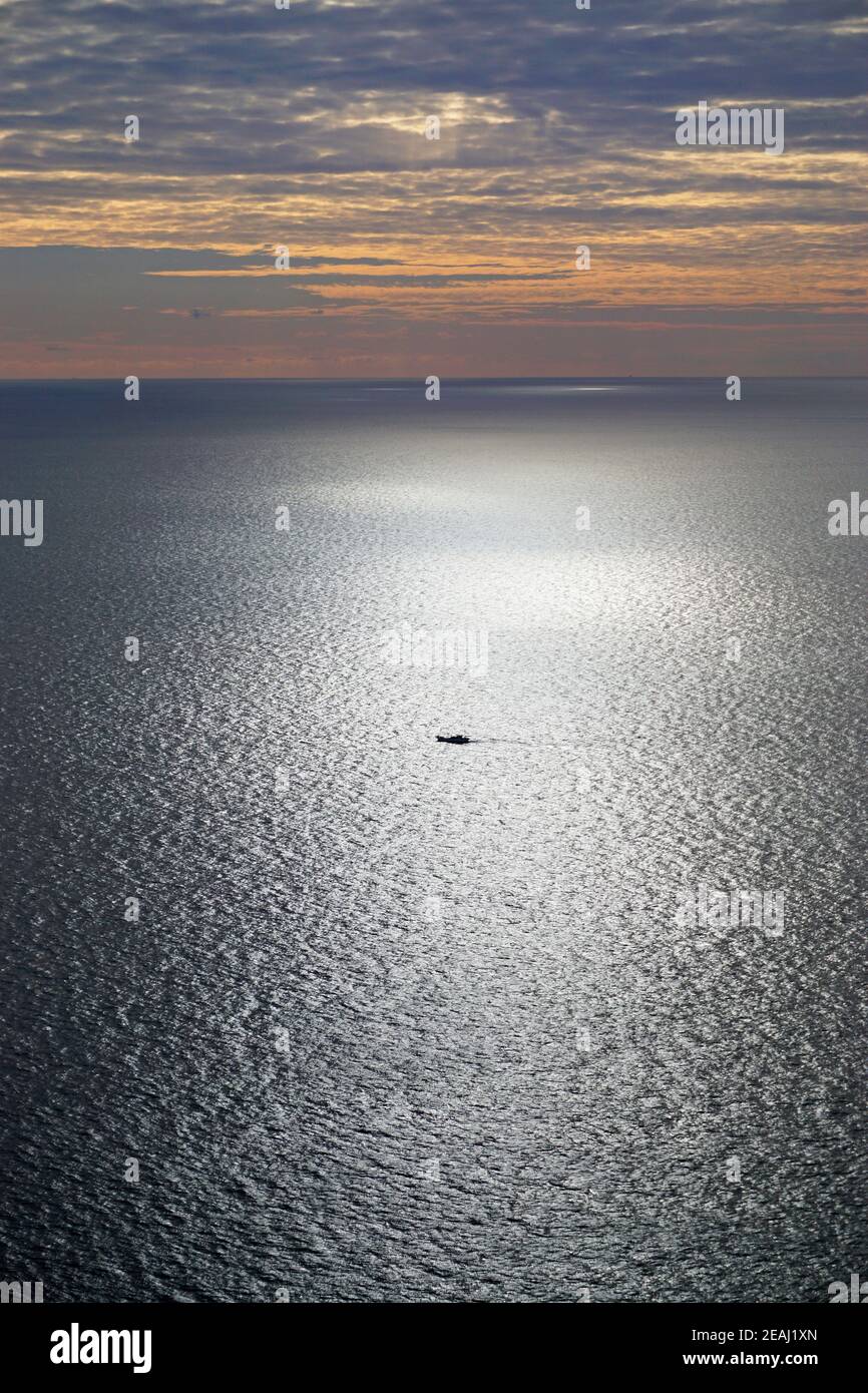 The vast ocean and small fishing boats Stock Photo - Alamy