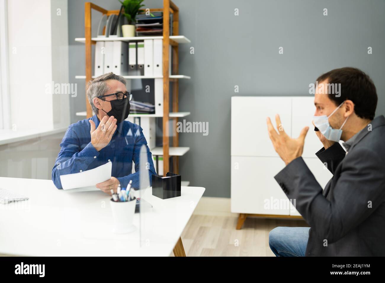 Angry Business Man Fighting At Work Stock Photo - Alamy