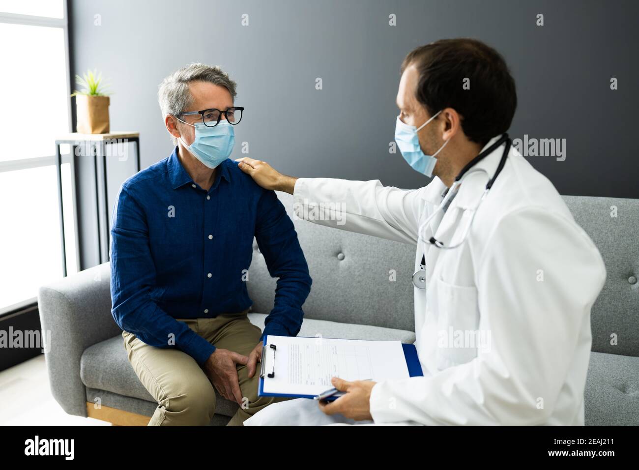 Doctor And Senior Patient Living Stock Photo - Alamy