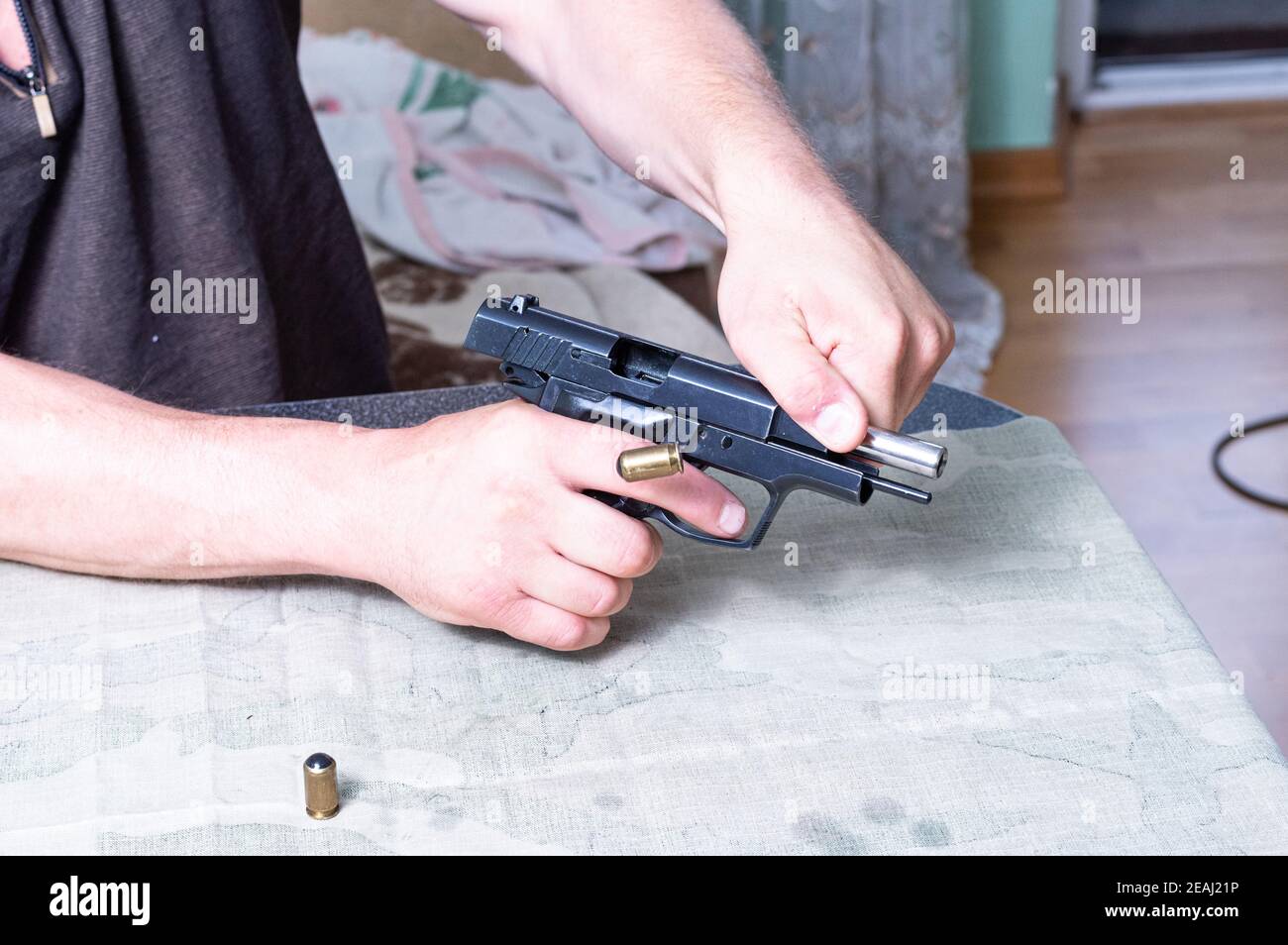 Load a pistol hi-res stock photography and images - Alamy