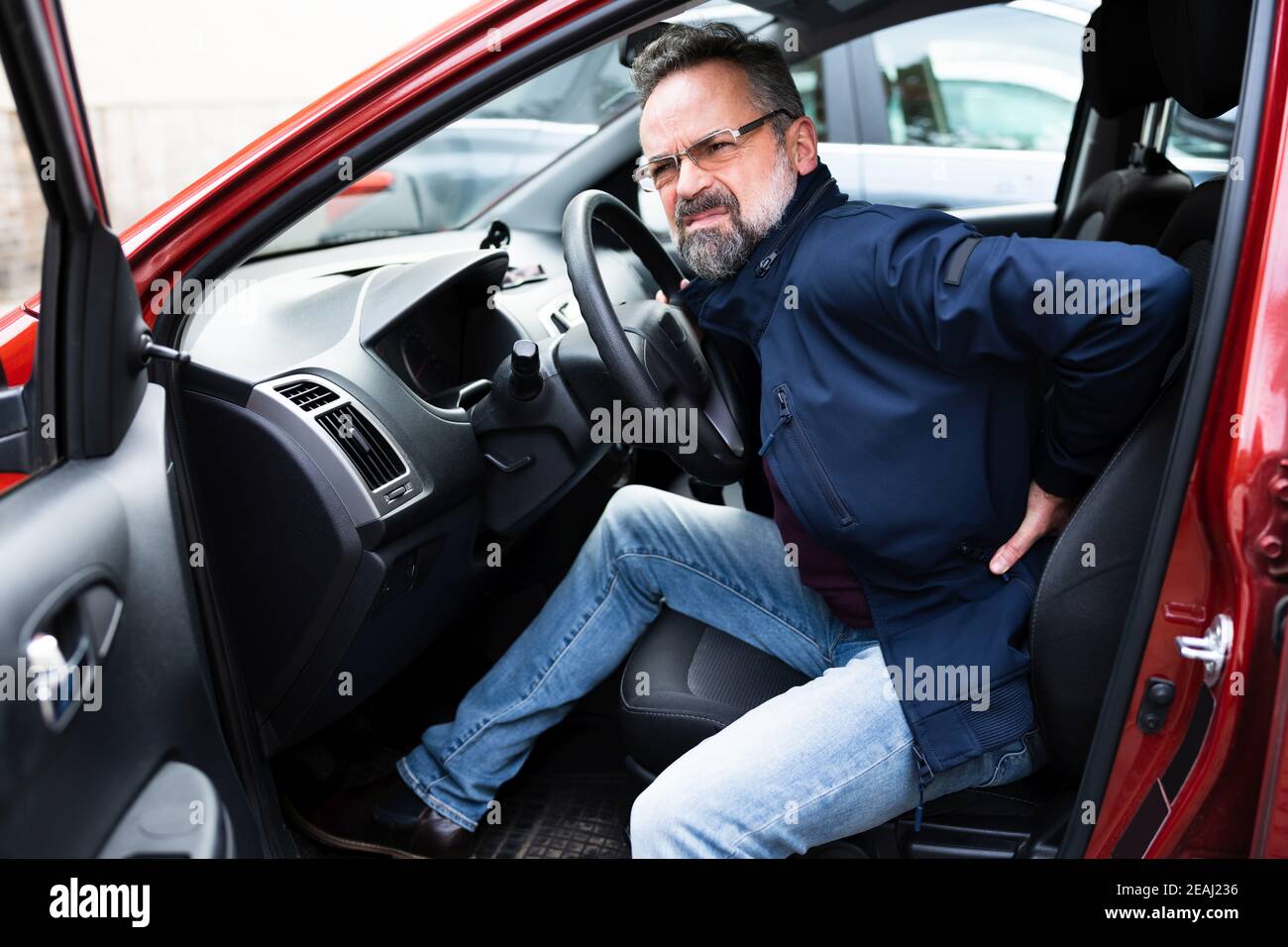 Back Pain Car Driving Injury Stock Photo - Alamy