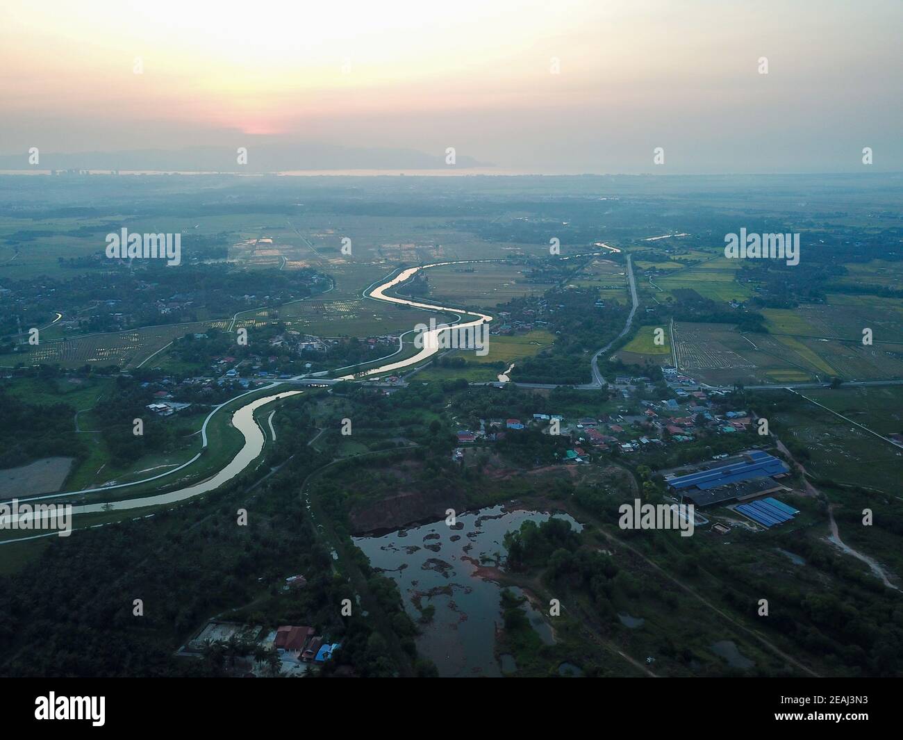 Aerial view paddy field near village Stock Photo - Alamy