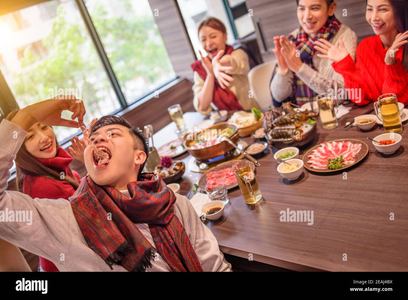 Female friends laughing restaurant table hi-res stock photography and ...