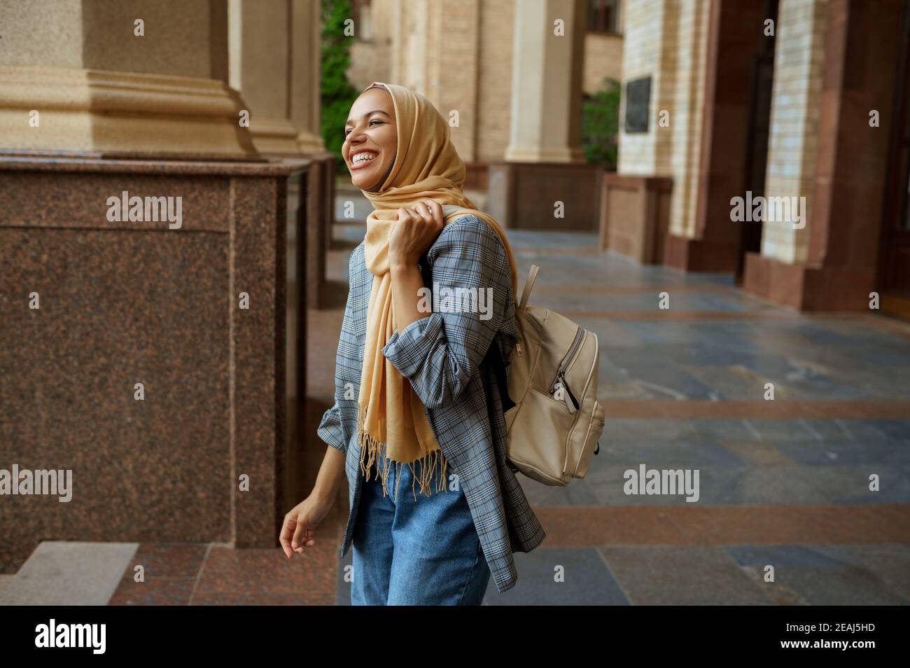 Arab student with books at university entrance Stock Photo - Alamy