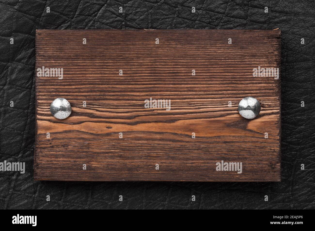 Frame, border made of wood, fastened with iron rivets to black leather ...