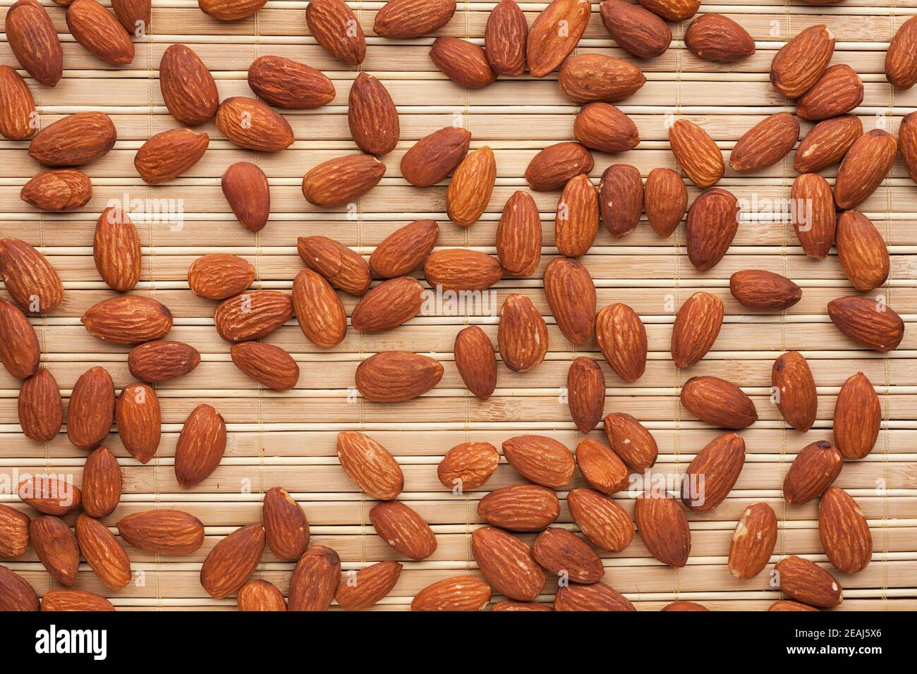 almond lying on a bamboo mat Stock Photo - Alamy