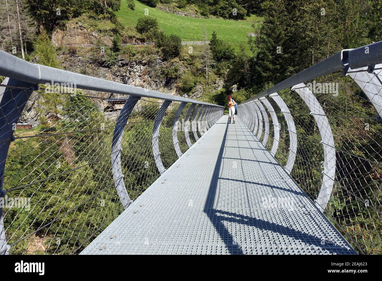 Hiking on the gorge trail Passeier Valley between Moos and St. Leonhard ...