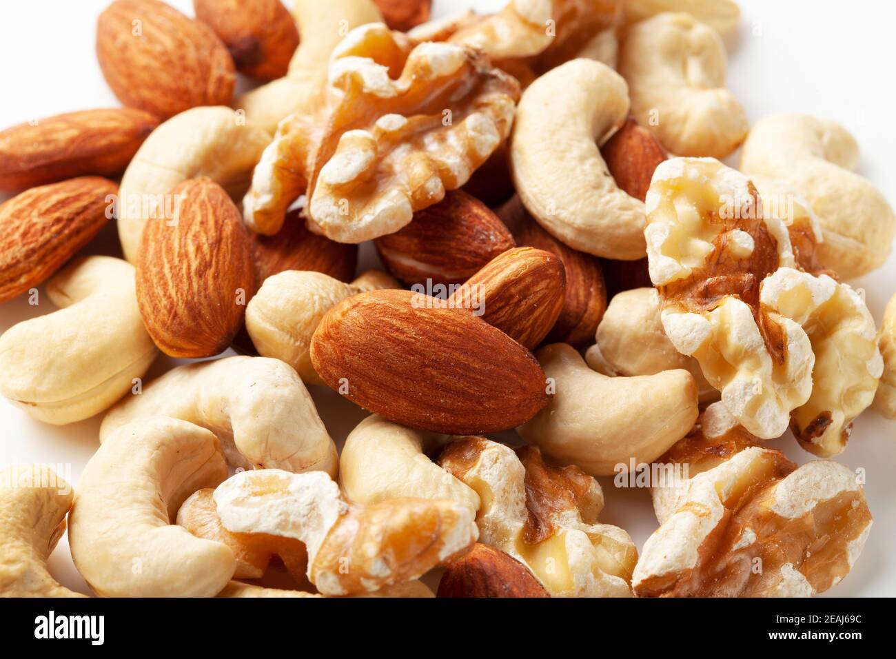 Assorted mixed nuts on white background Stock Photo - Alamy