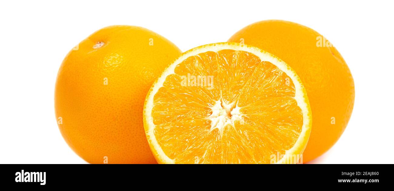 Two whole oranges and half an orange isolated on a white background ...