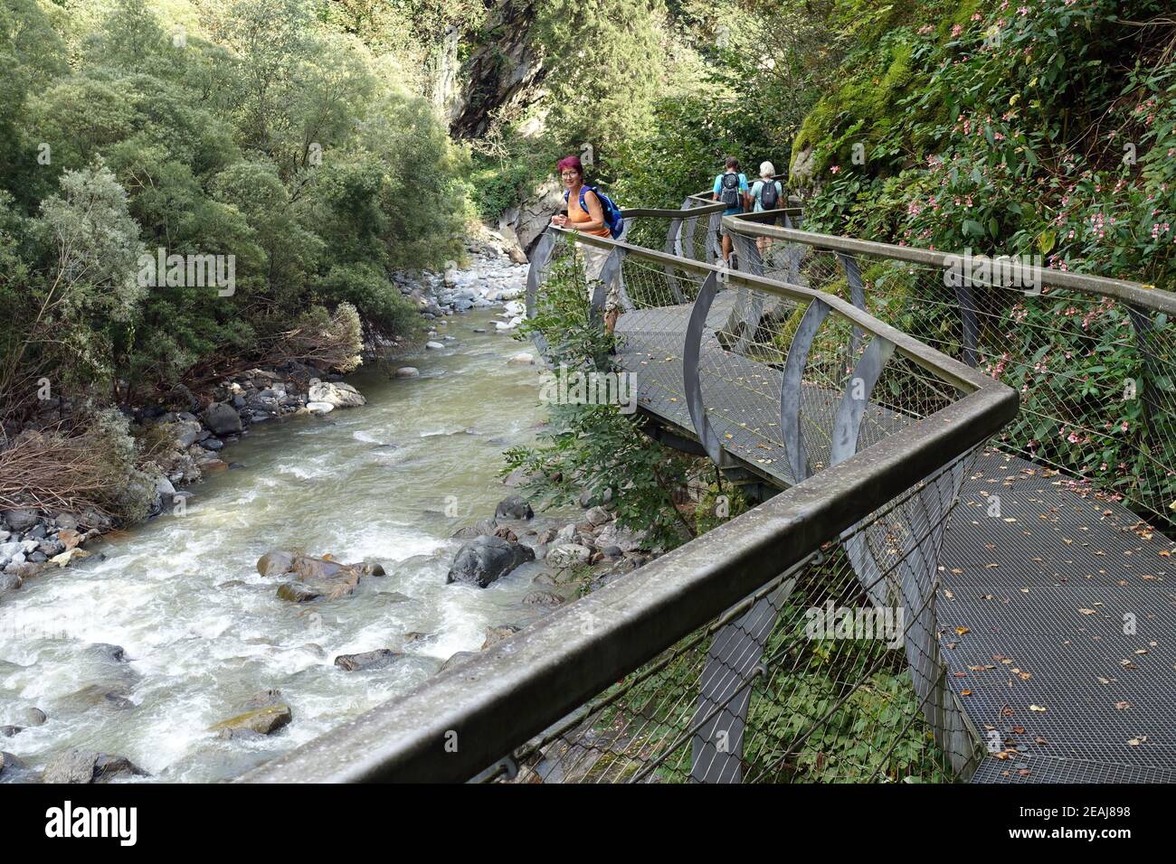 Hiking on the gorge trail Passeier Valley between Moos and St. Leonhard ...