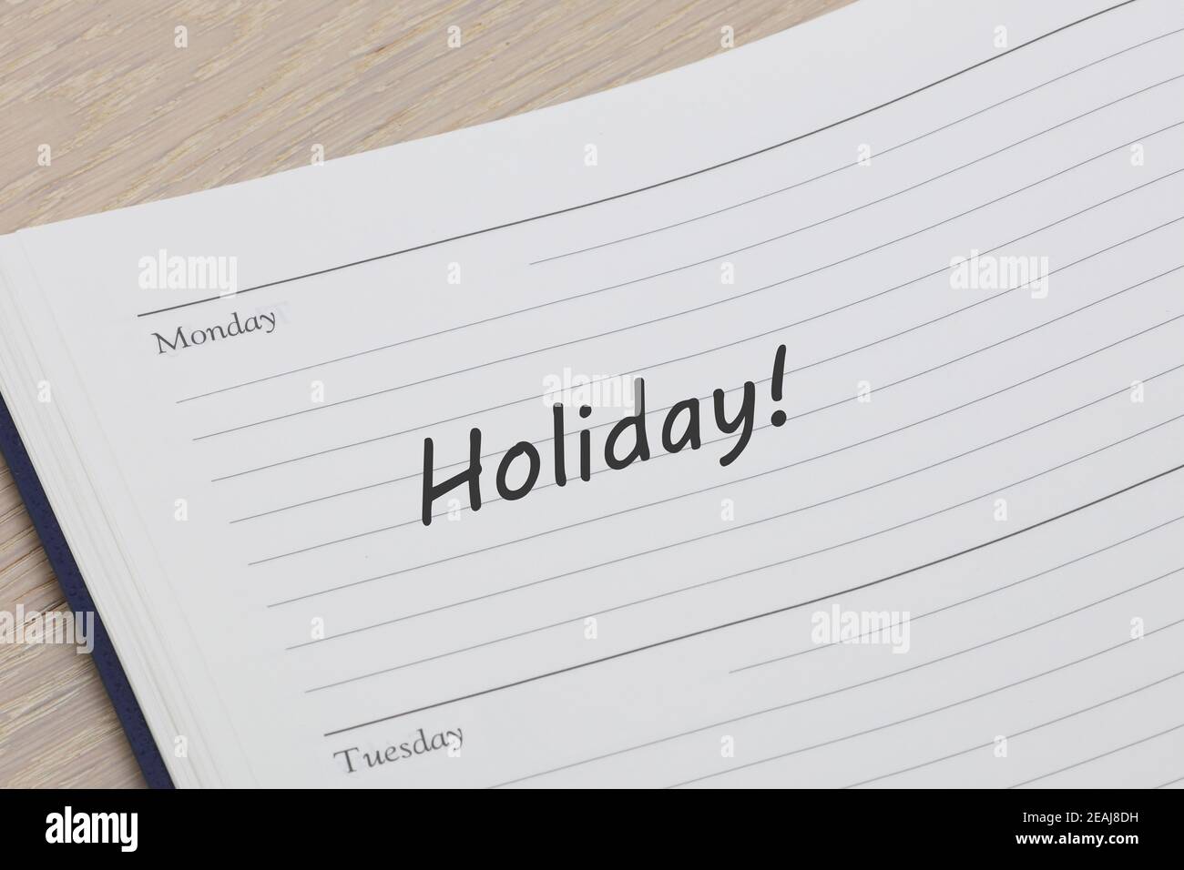 Holiday reminder note in a diary page Stock Photo - Alamy