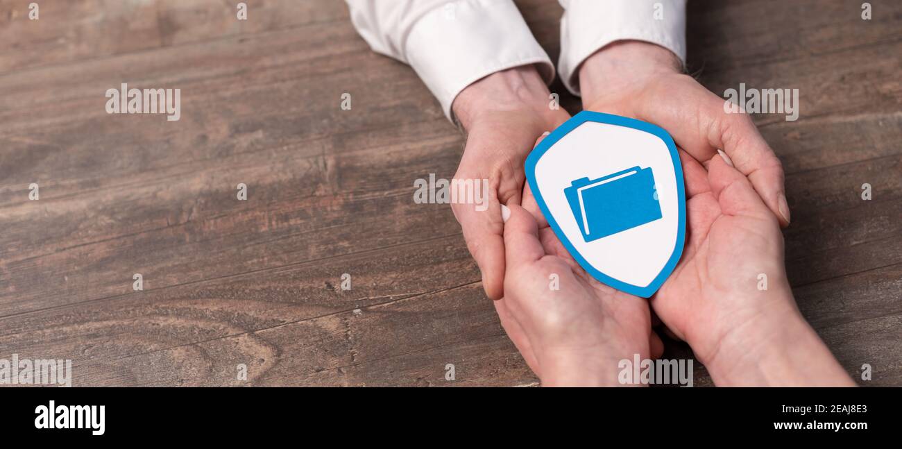 Concept of data protection with paper shield in hands Stock Photo - Alamy