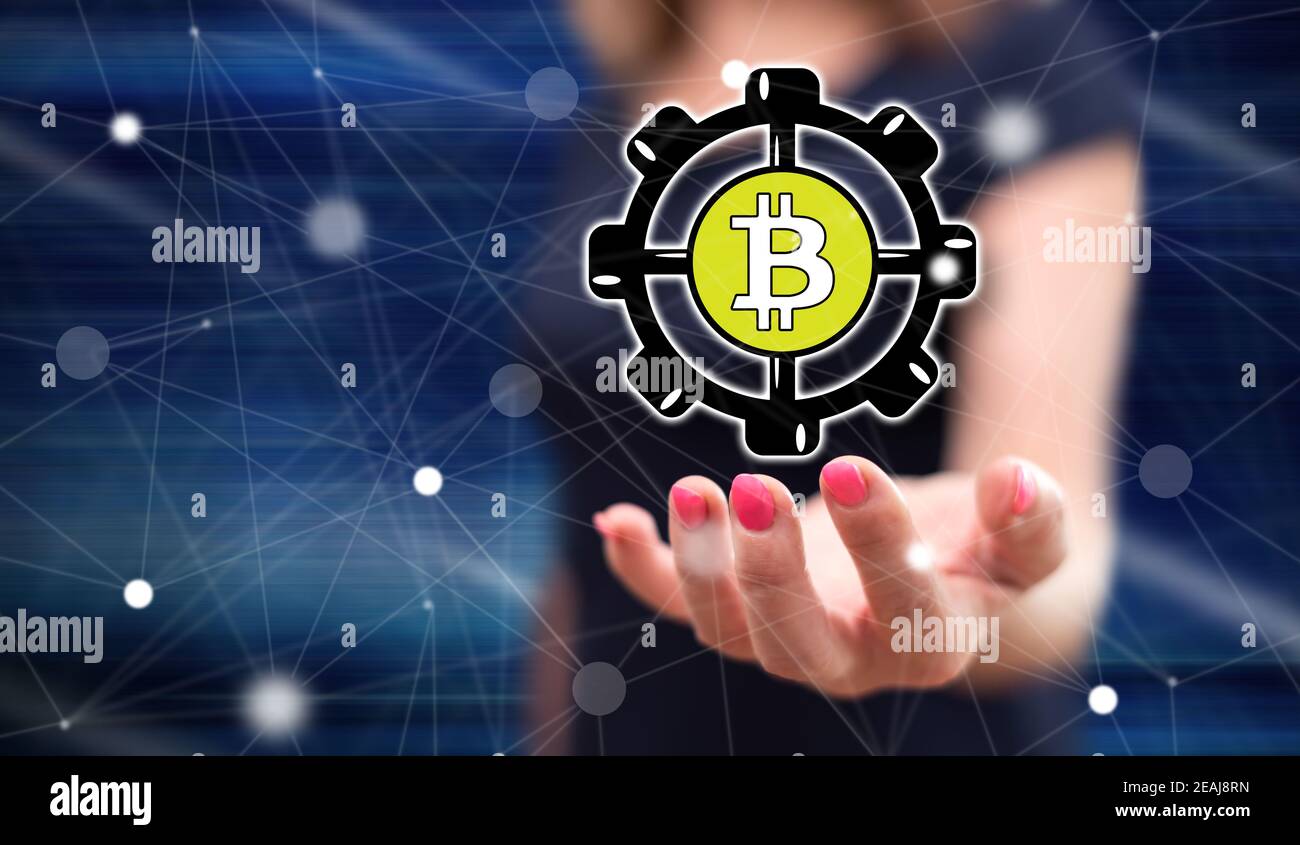 Bitcoin development concept above the hand of a woman in background ...