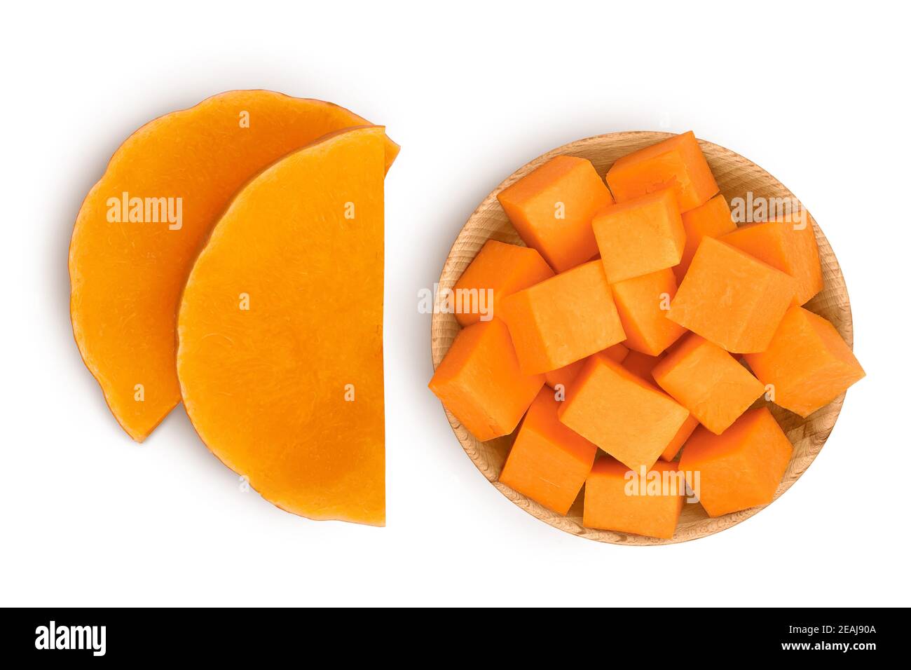 butternut squash diced in wooden bowl isolated on white background with ...