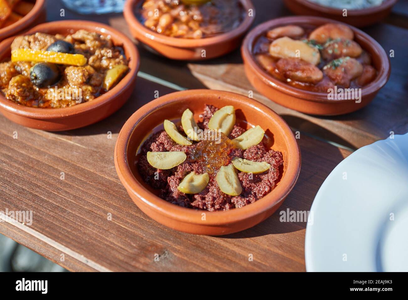Tapas served in many small plates Stock Photo - Alamy