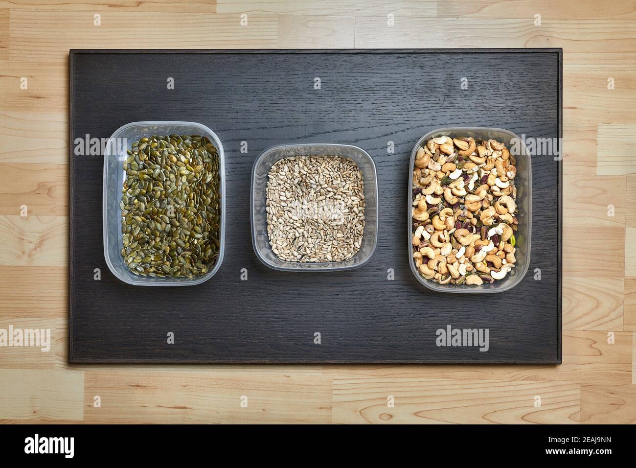 Nuts and seed in boxes Stock Photo - Alamy