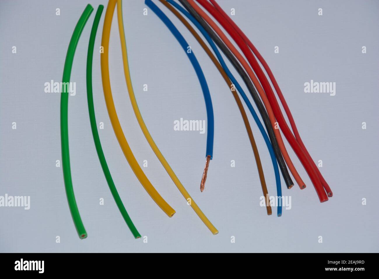 different Electricity copper cables on white background Stock Photo - Alamy