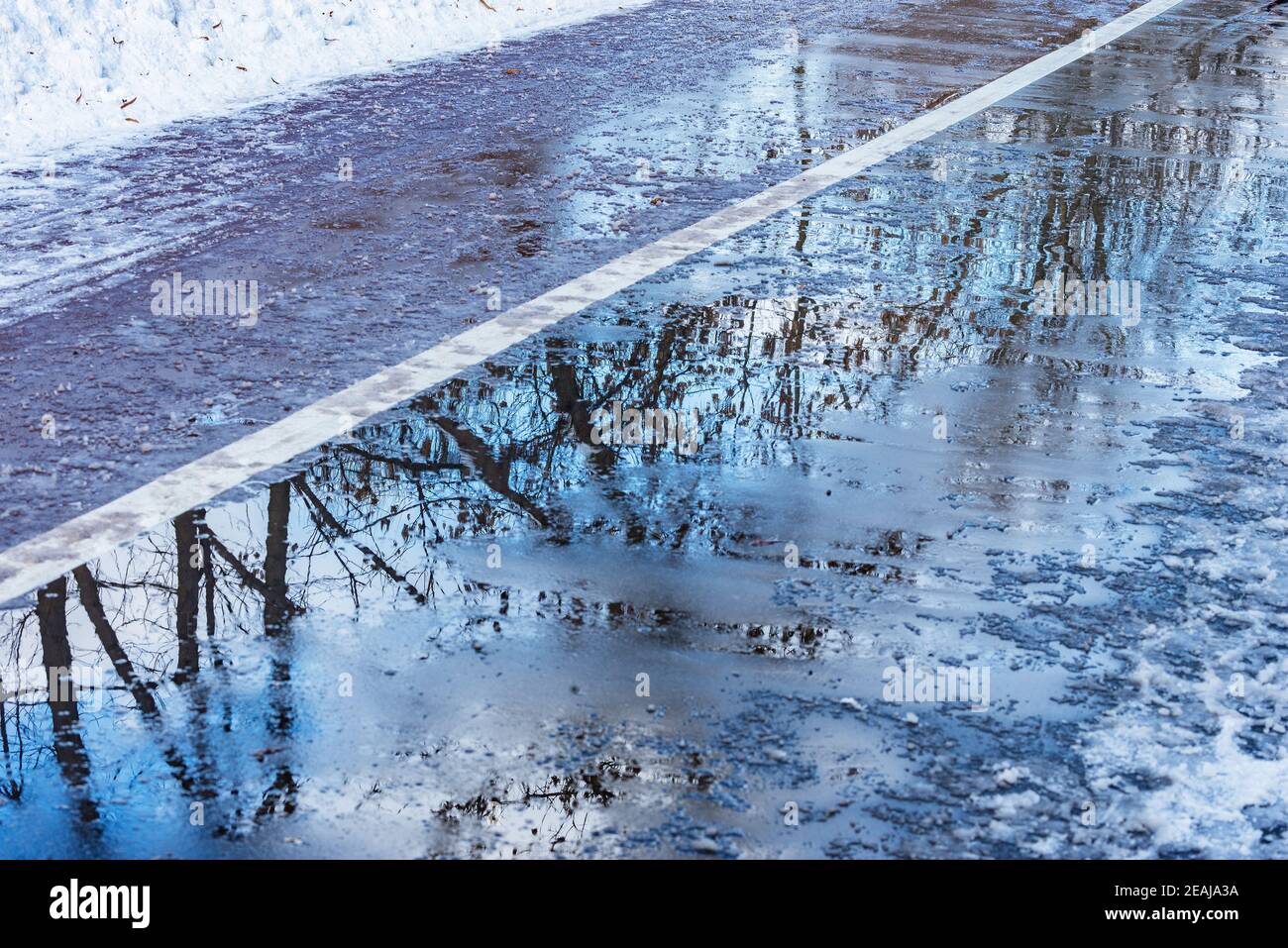 Wet asphalt road surface at winter morning Stock Photo - Alamy