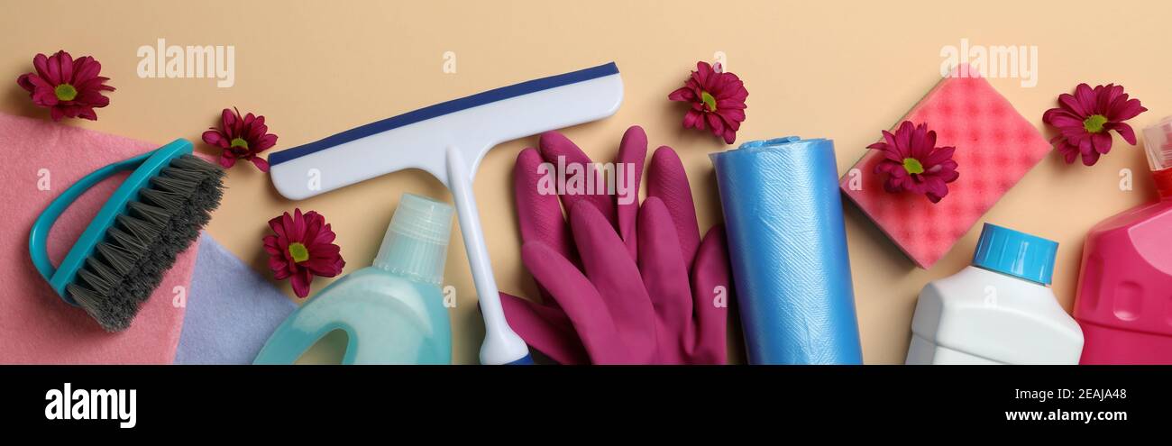 Different cleaning tools on beige background, top view Stock Photo - Alamy
