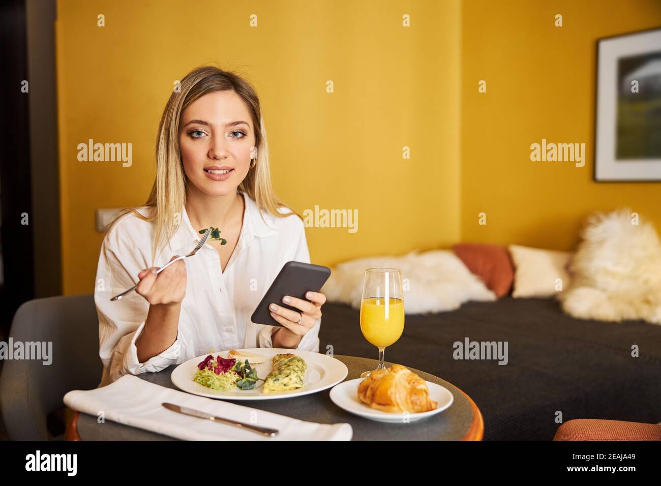 Modern business lady having breakfast in her hotel room Stock Photo - Alamy