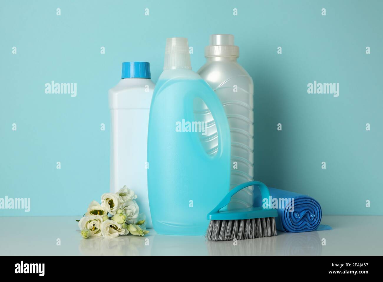 Cleaning tools on blue background, space for text Stock Photo - Alamy