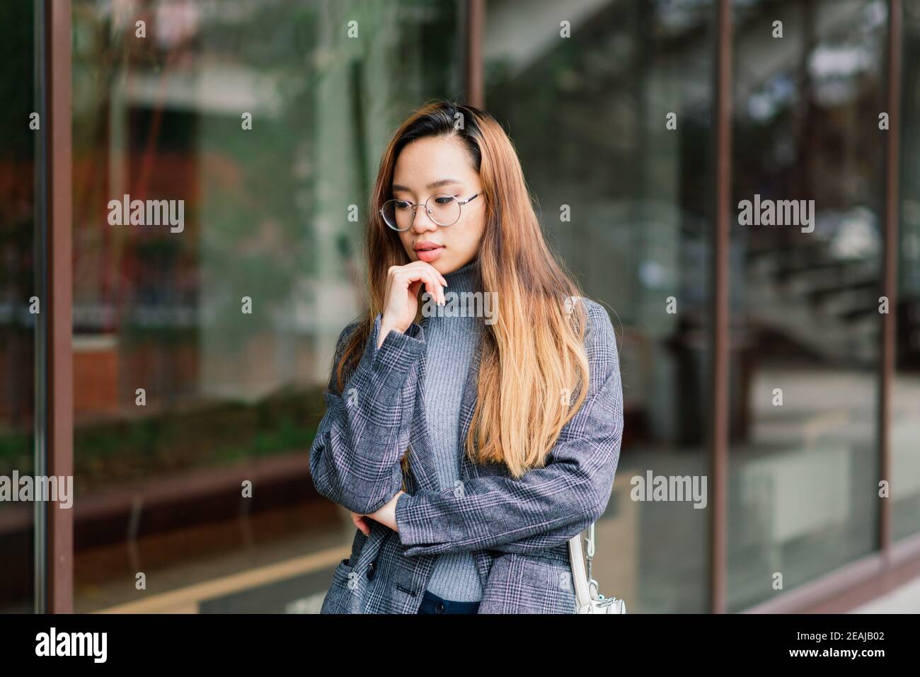 Young Asian woman, sad face portrait in city at the evening Stock Photo ...