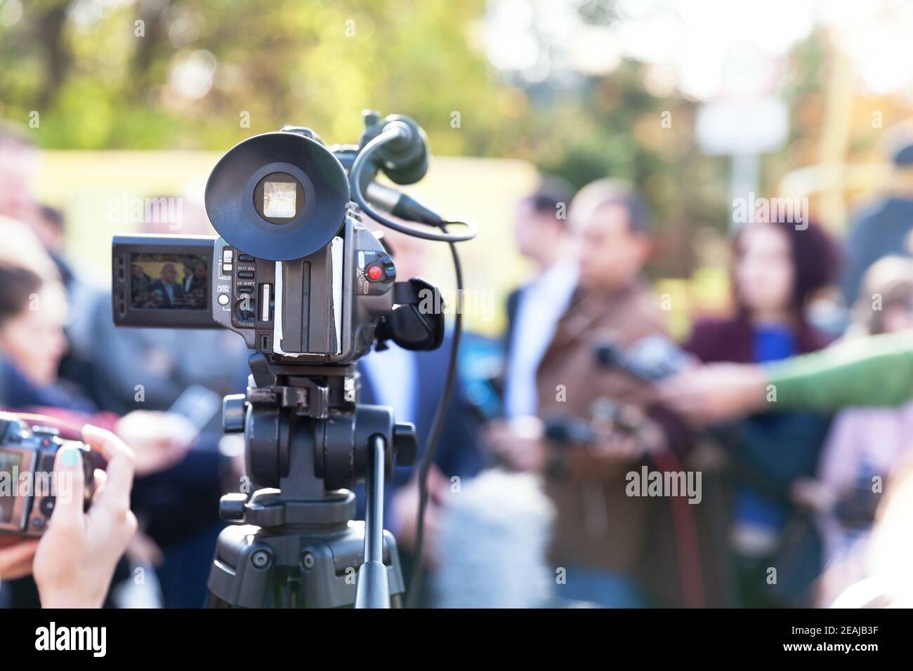 Filming an media event with a video camera. Press conference Stock ...