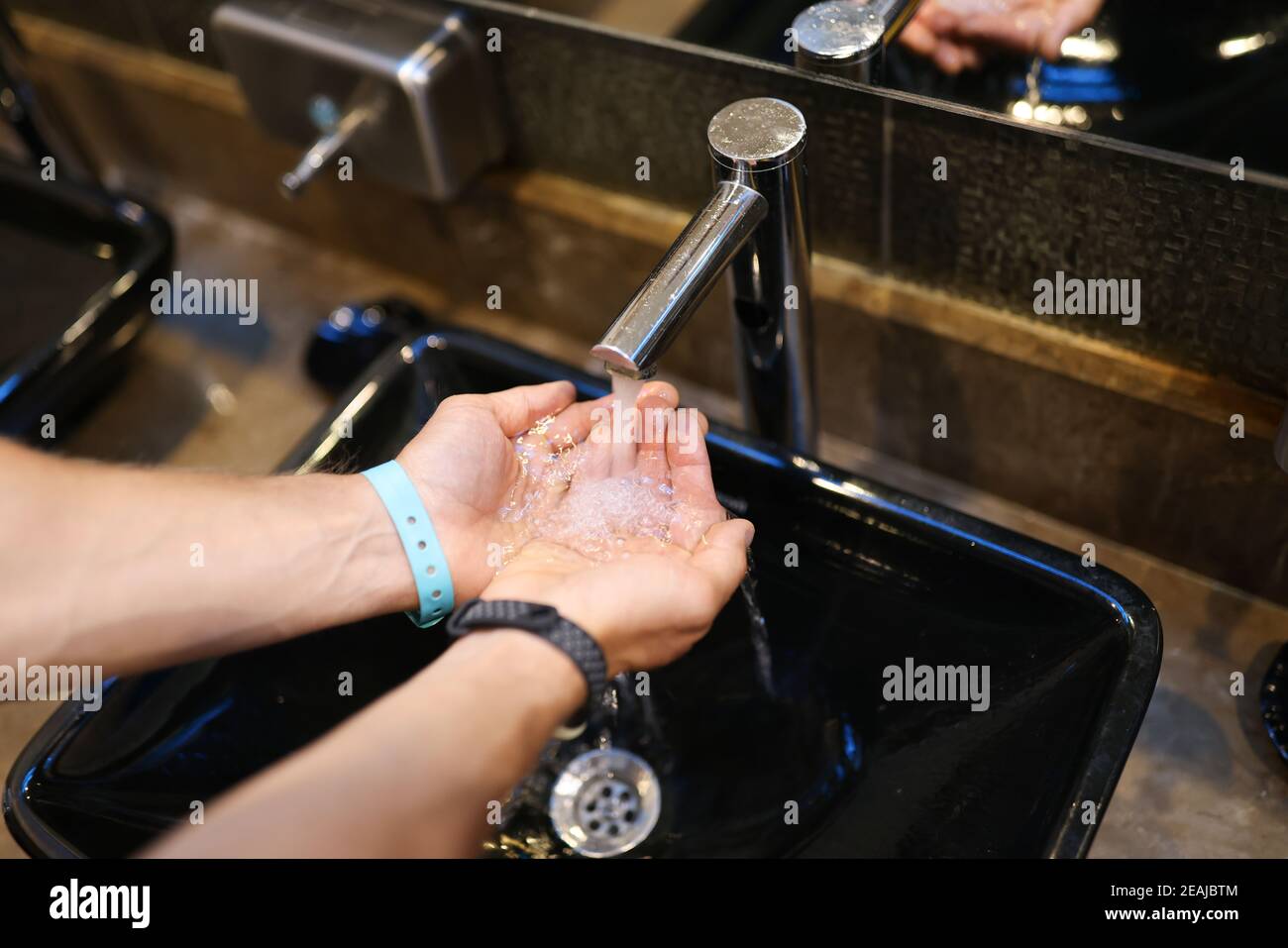 Washing hands in sink. Clean hands guarantee health Stock Photo - Alamy