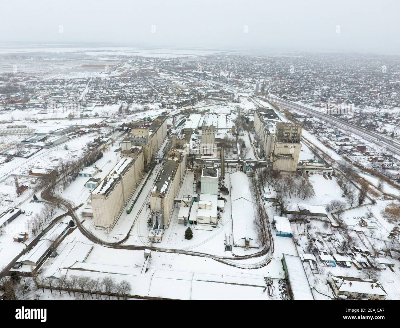 Sprinkled with snow grain elevator. Winter view of the old Soviet ...