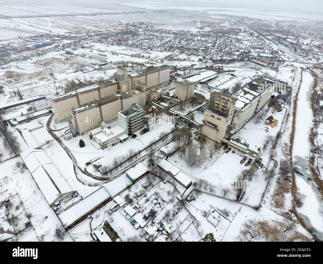 Sprinkled with snow grain elevator. Winter view of the old Soviet ...