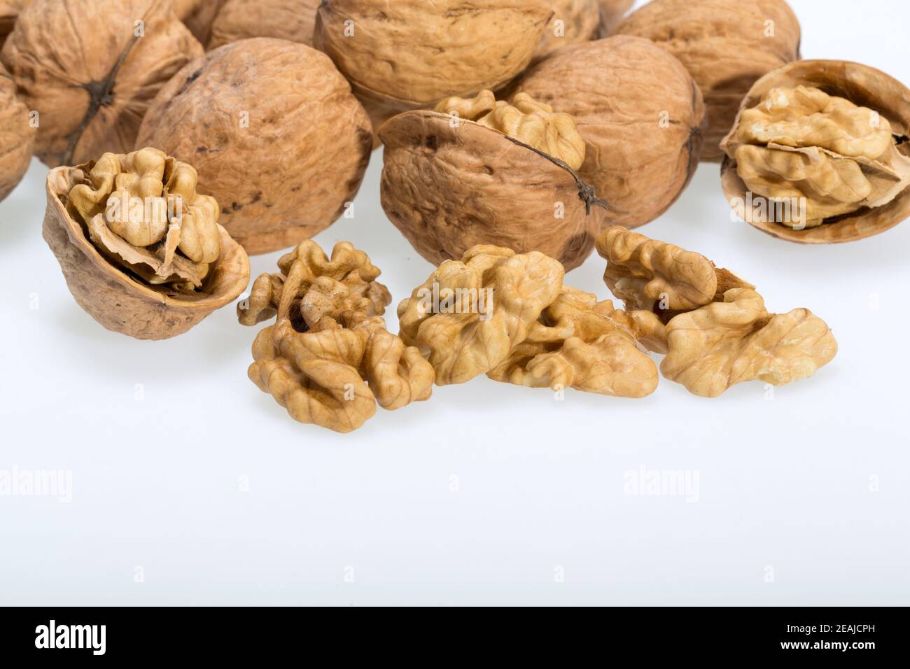 walnut and a cracked walnut isolated Stock Photo - Alamy