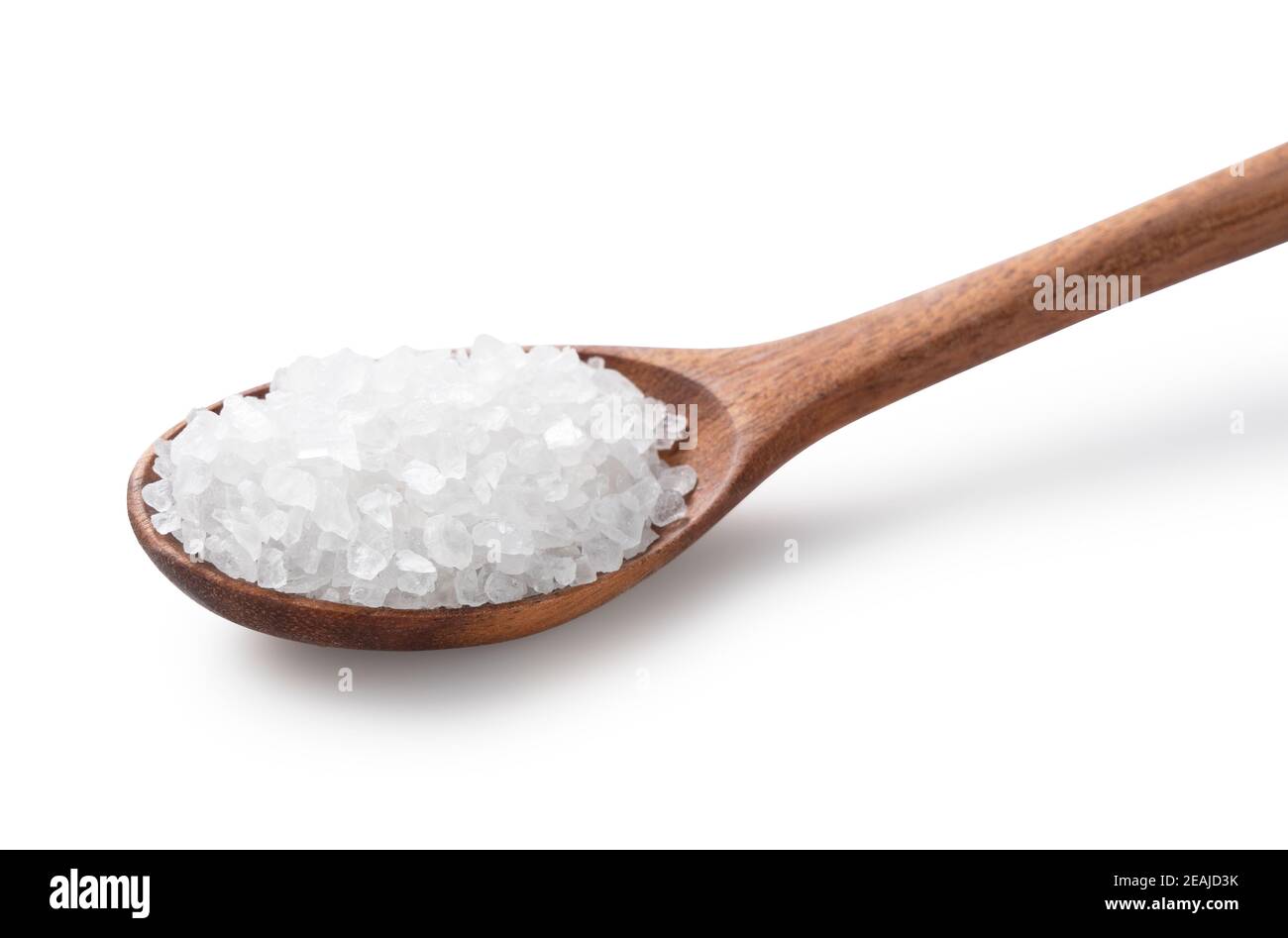 Himalayan rock salt in a spoon placed on a white background Stock Photo ...