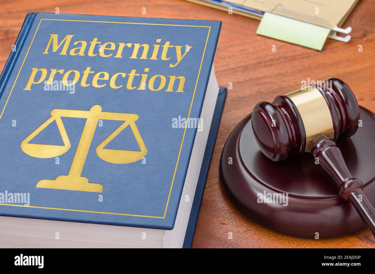 Law book with a gavel - Maternity protection Stock Photo - Alamy