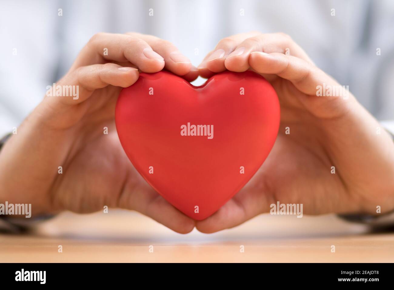 Hand offering heart symbol hi-res stock photography and images - Alamy
