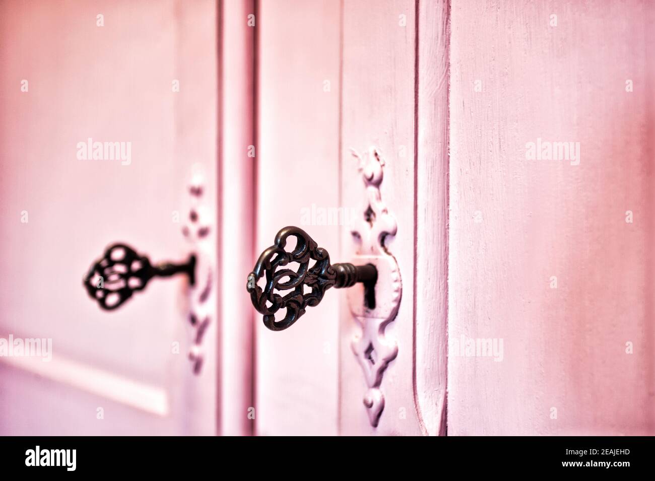 Pink vintage antique doors with old skeleton keys in lock wooden ...