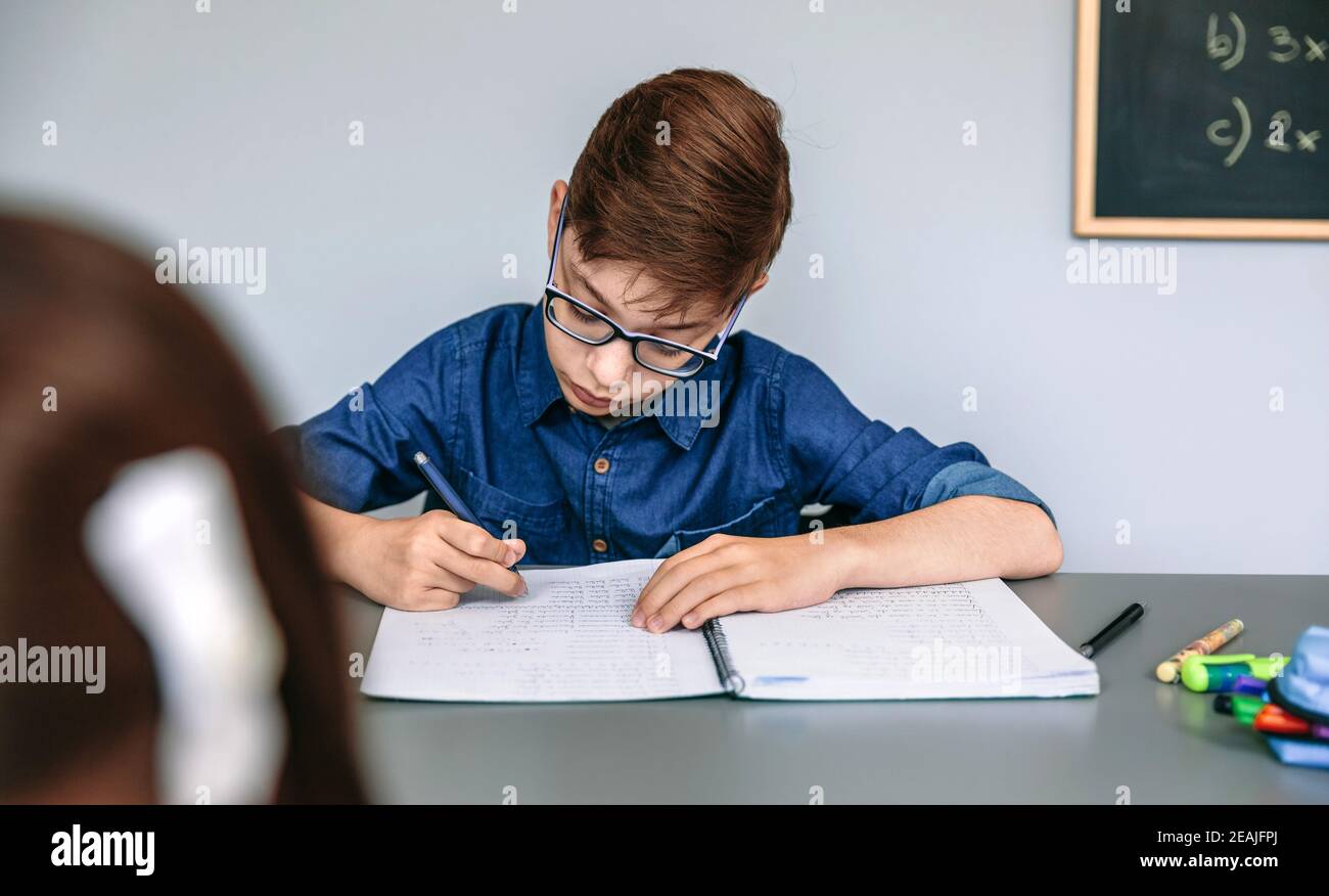 Boy blackboard writing shirt hi-res stock photography and images - Alamy