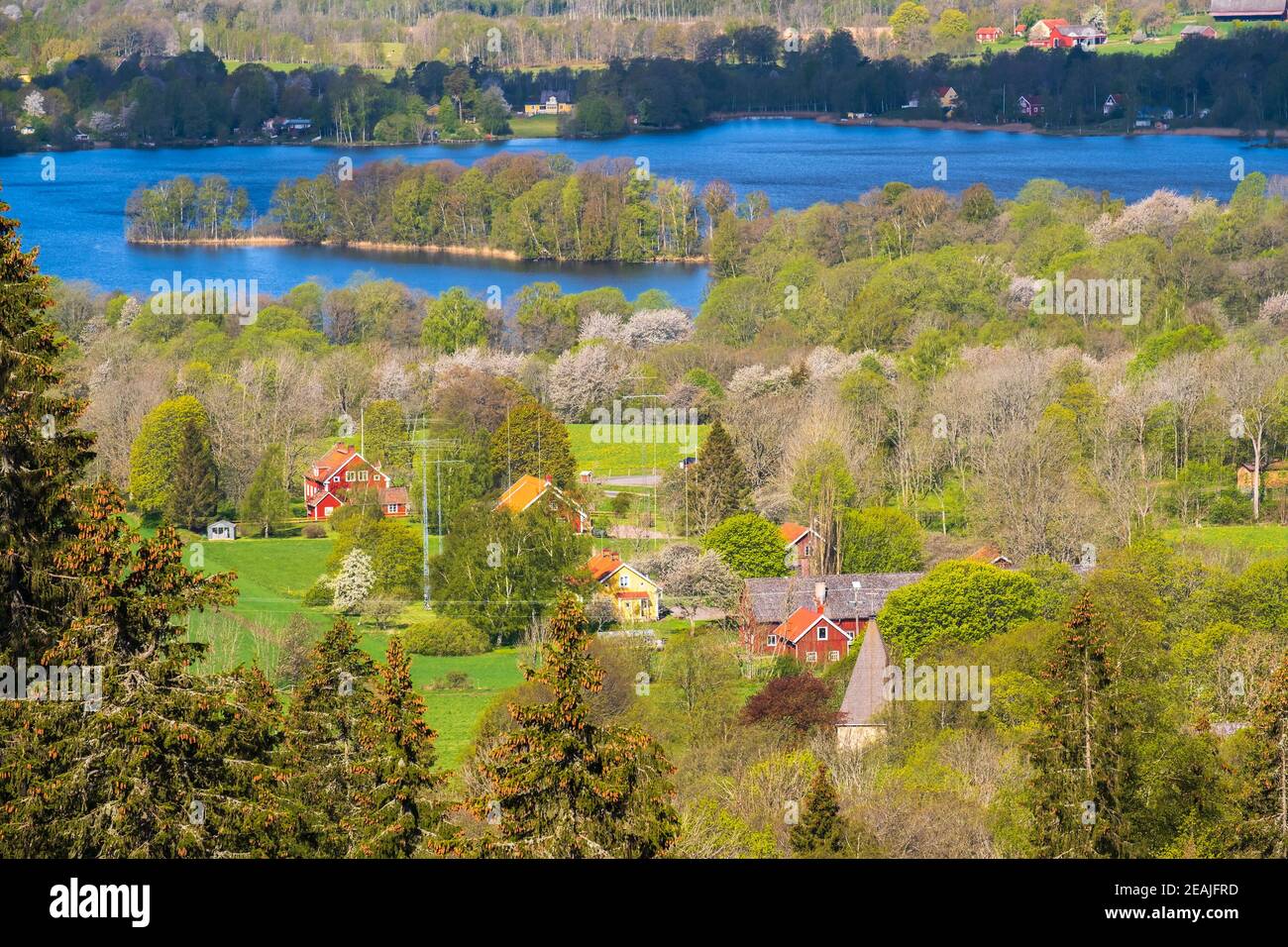 Idyllic country village view at a lake in the budding spring Stock ...