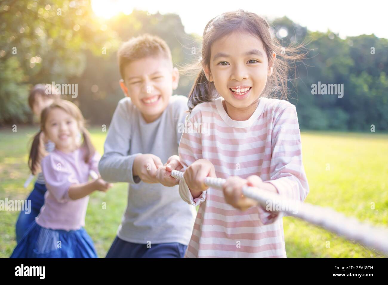 Group children playing tug war hi-res stock photography and images - Alamy
