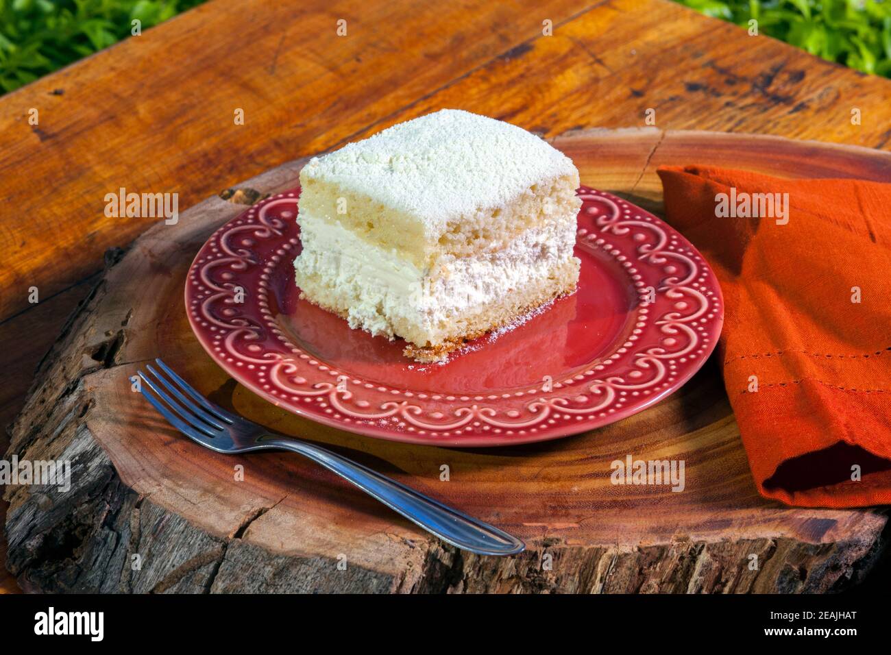 Cake with milk powder coating Stock Photo - Alamy
