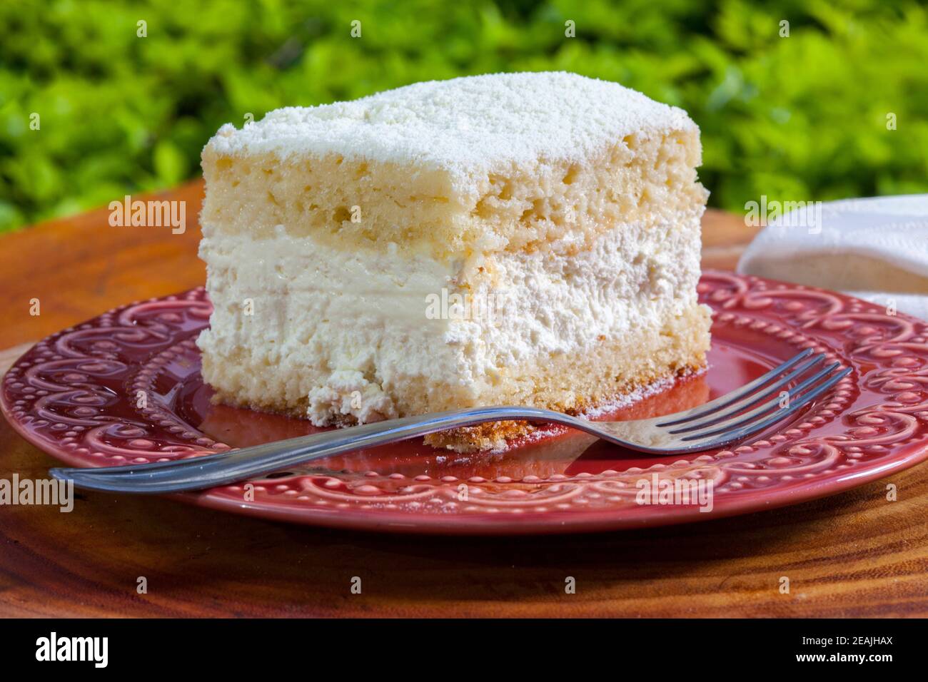 Cake with milk powder coating Stock Photo - Alamy