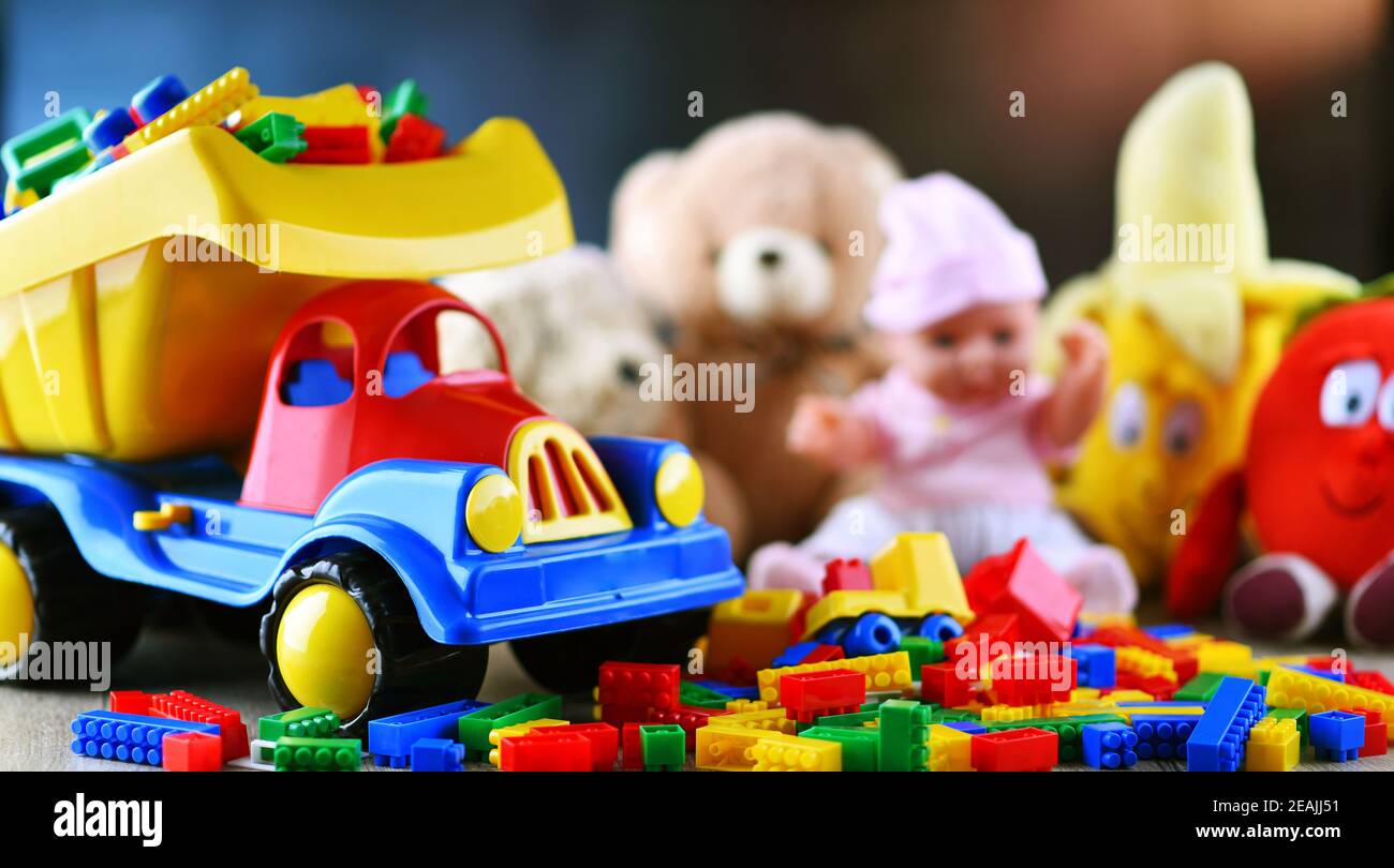 Colorful plastic and plush toys in a children's room Stock Photo - Alamy