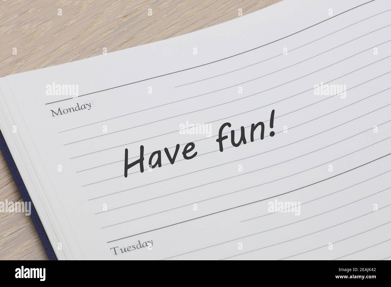 Have fun reminder note in a diary page Stock Photo - Alamy