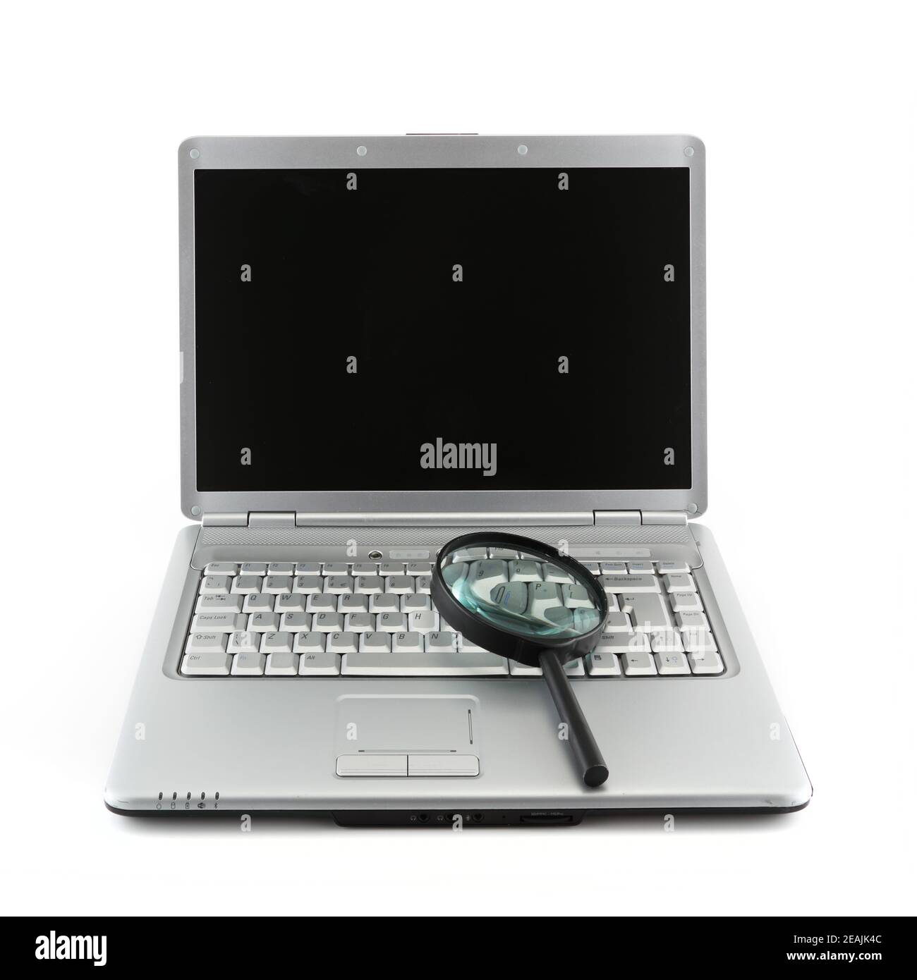 Laptop PC and magnifying glass indicating data security concept Stock ...