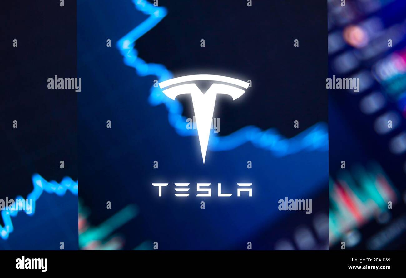 The Tesla logo on the background of the growth of the companys shares ...